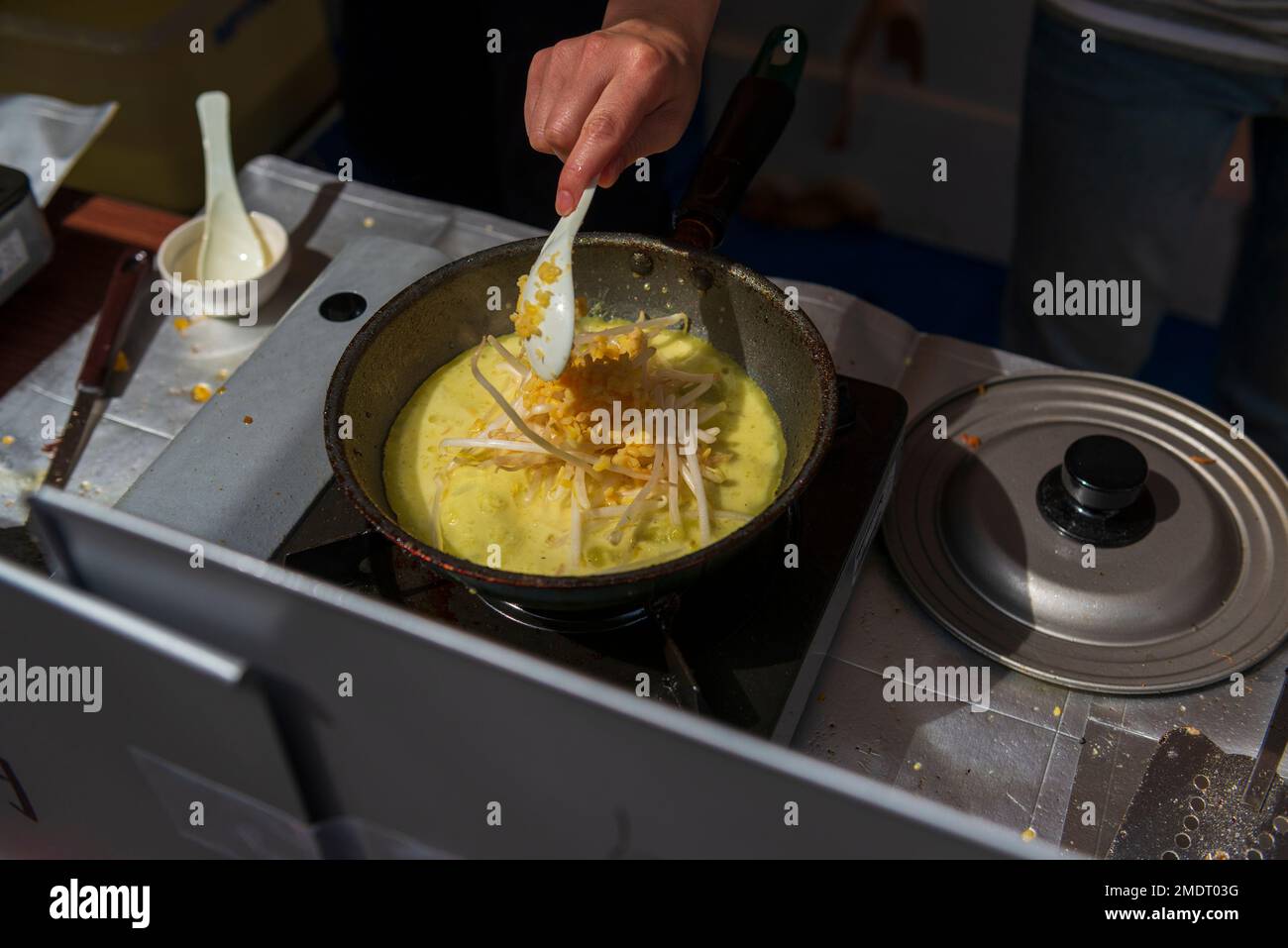 Cooking rice soup. Japan street food Stock Photo - Alamy