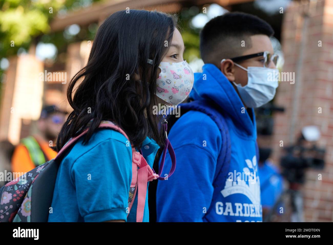 Nine-year-old Madelyn Galindo, front, and 8-year-old Dylan Salazar wait ...
