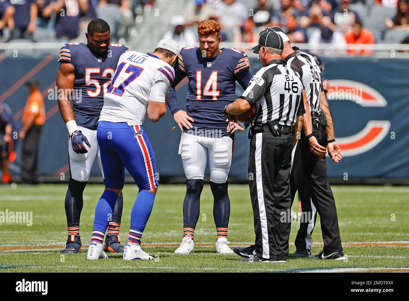 Referee Clete Blakeman (34) tosses a coin as Buffalo Bills quarterback ...