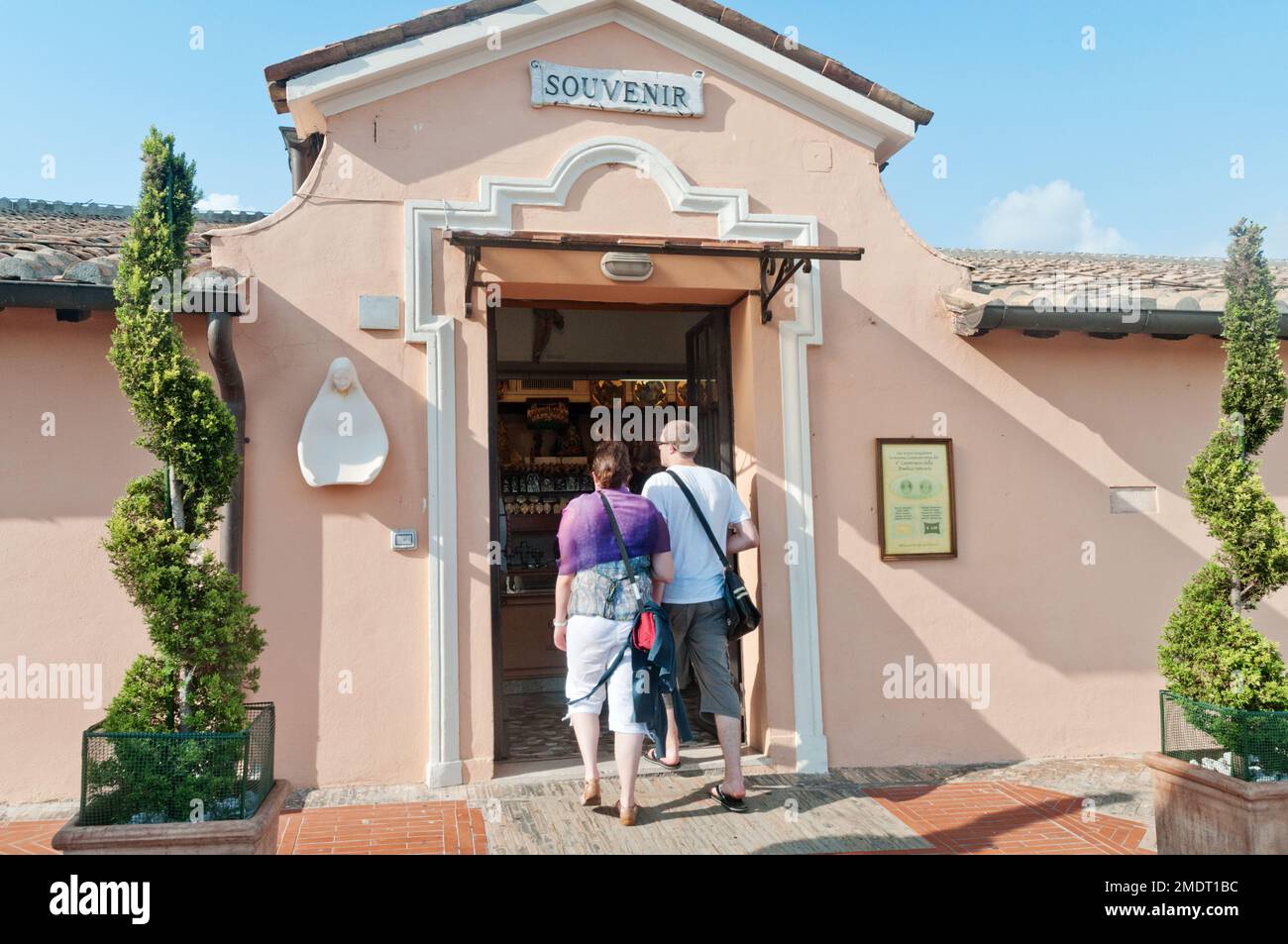 Tourists entering the souvenir shop half way up to the dome of St Peter ...