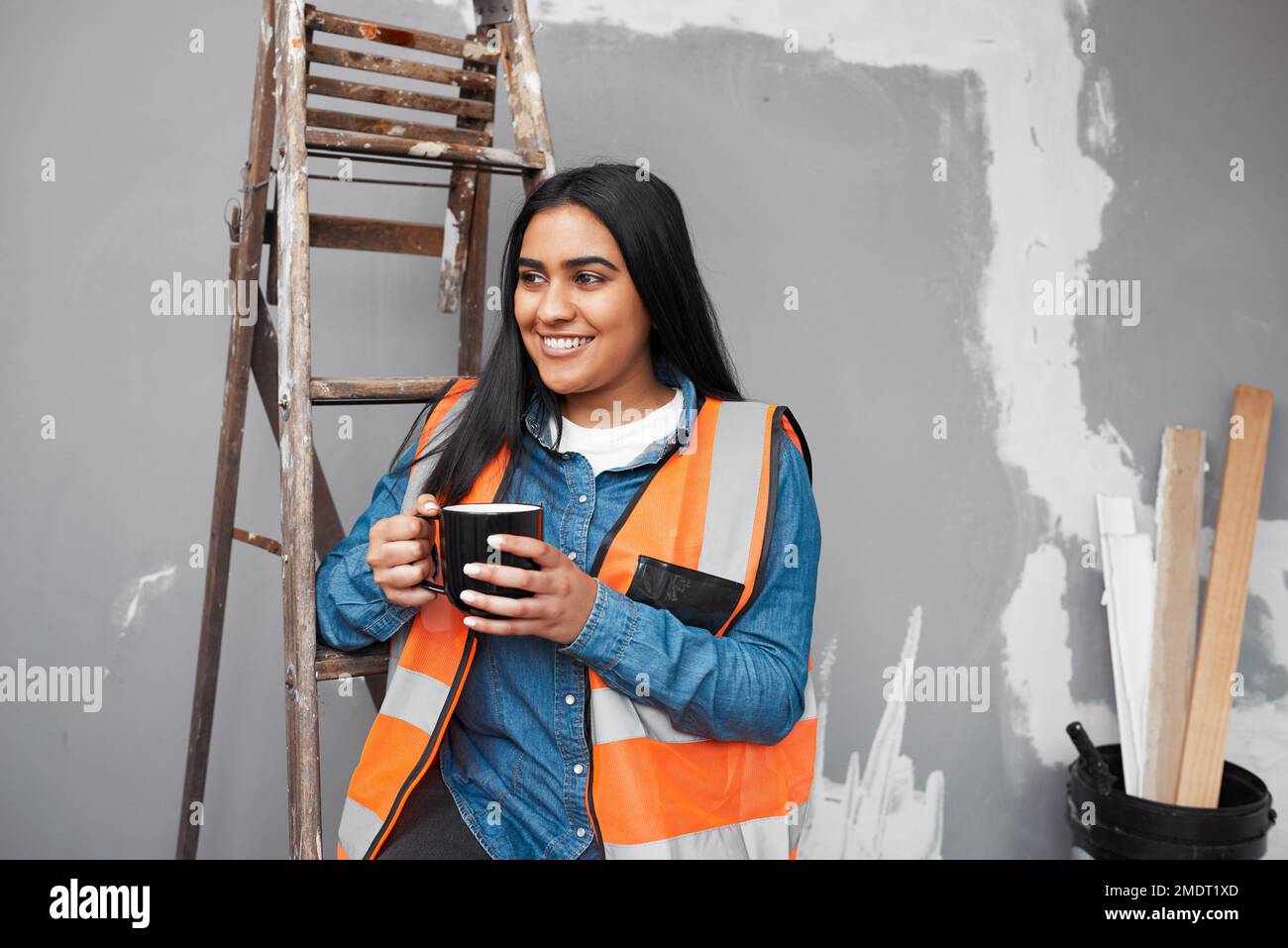 A young female construction worker takes a coffee break on site Stock ...