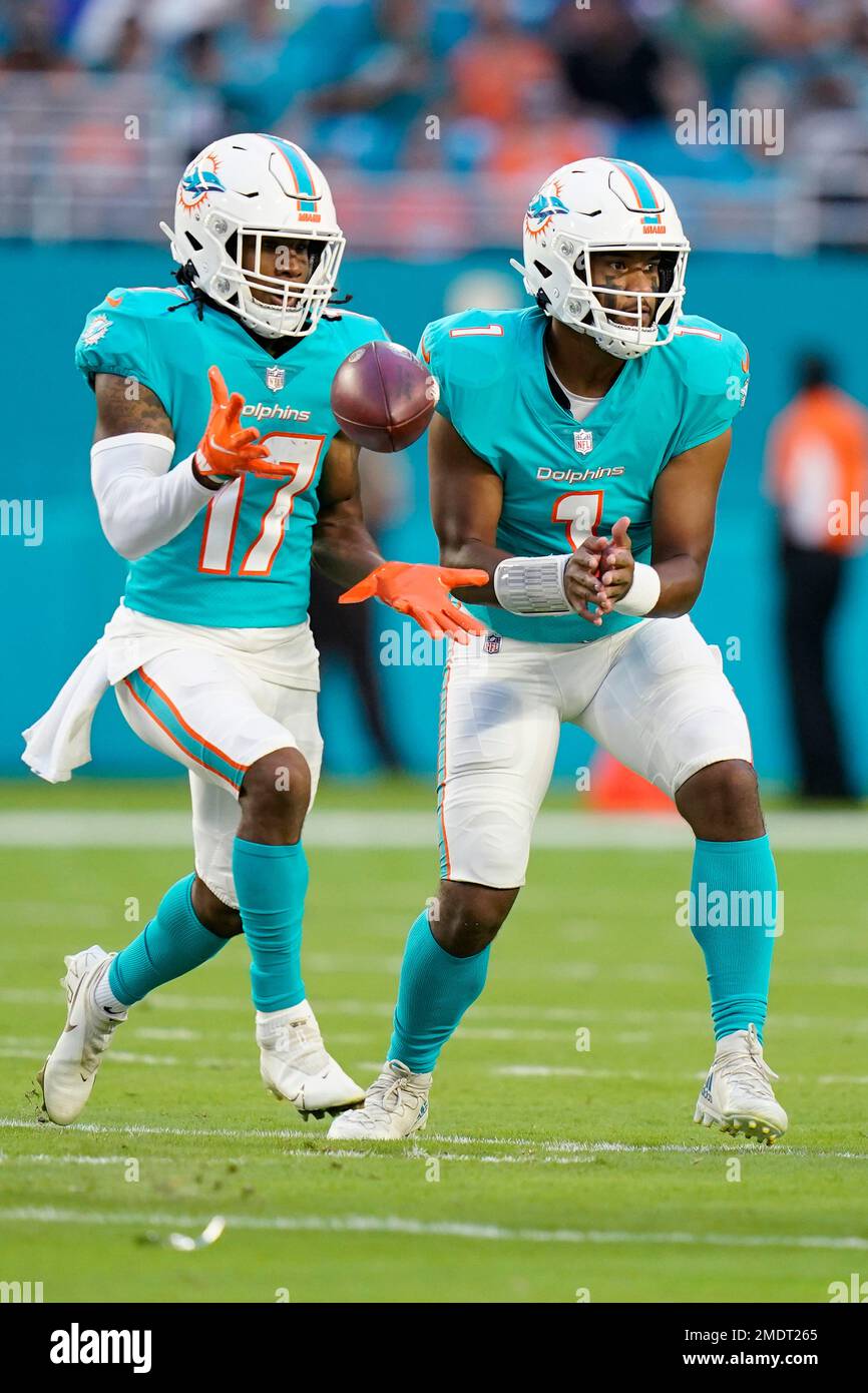 Miami Dolphins quarterback Tua Tagovailoa (1) passes the ball to wide receiver Jaylen Waddle (17 ...