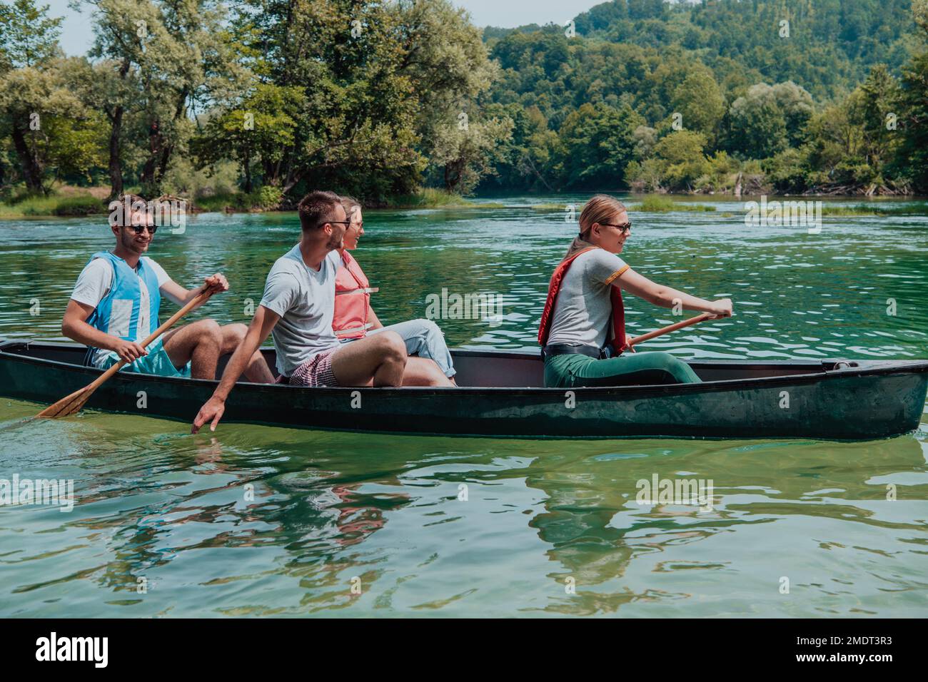 Group adventurous explorer friends are canoeing in a wild river Stock ...