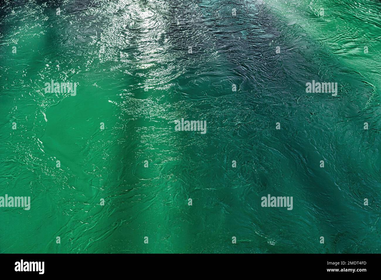 The texture of the waves of turquoise color of fast-flowing water in ...