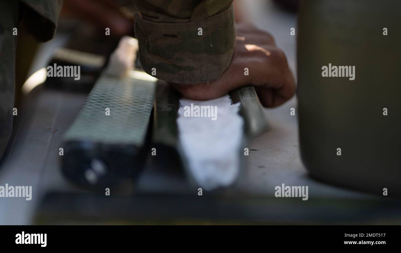 A Soldier assigned to the 483rd Area Clearance Platoon, build a ...