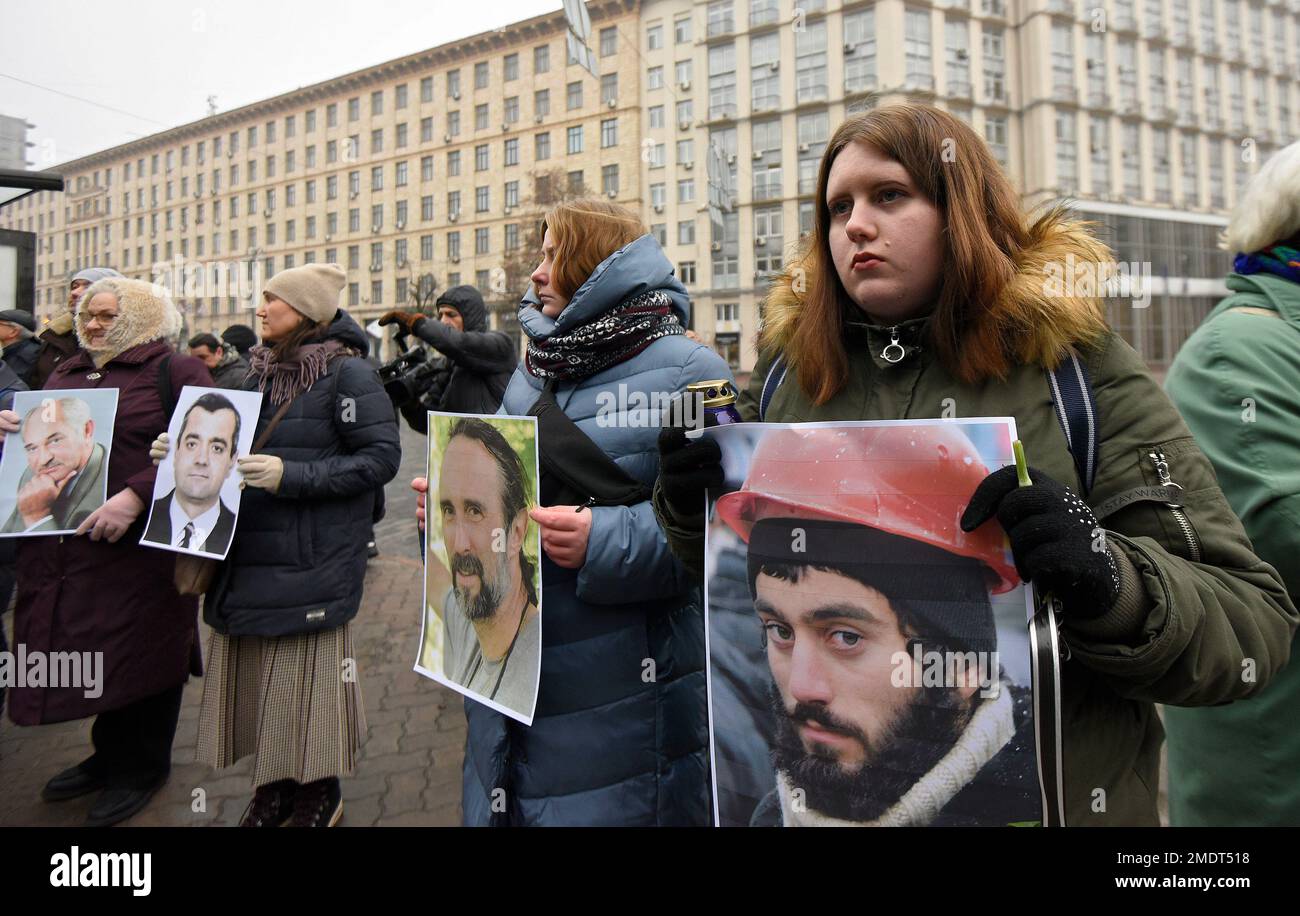 KYIV, UKRAINE - JANUARY 22, 2023 - Women hold portraits of the first ...