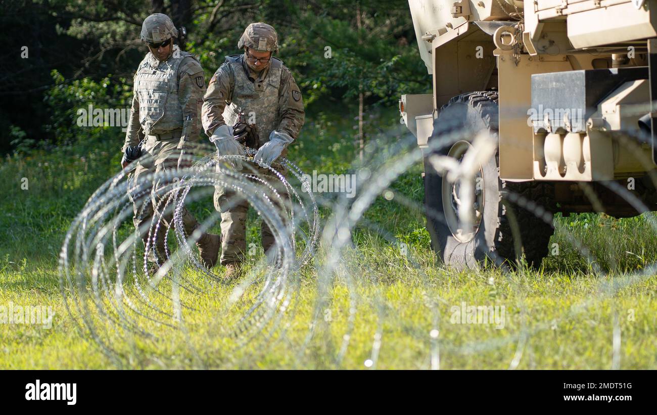 U.S. Army Spc. Michael Weining, 483rd Area Clearance Platoon, creates a ...