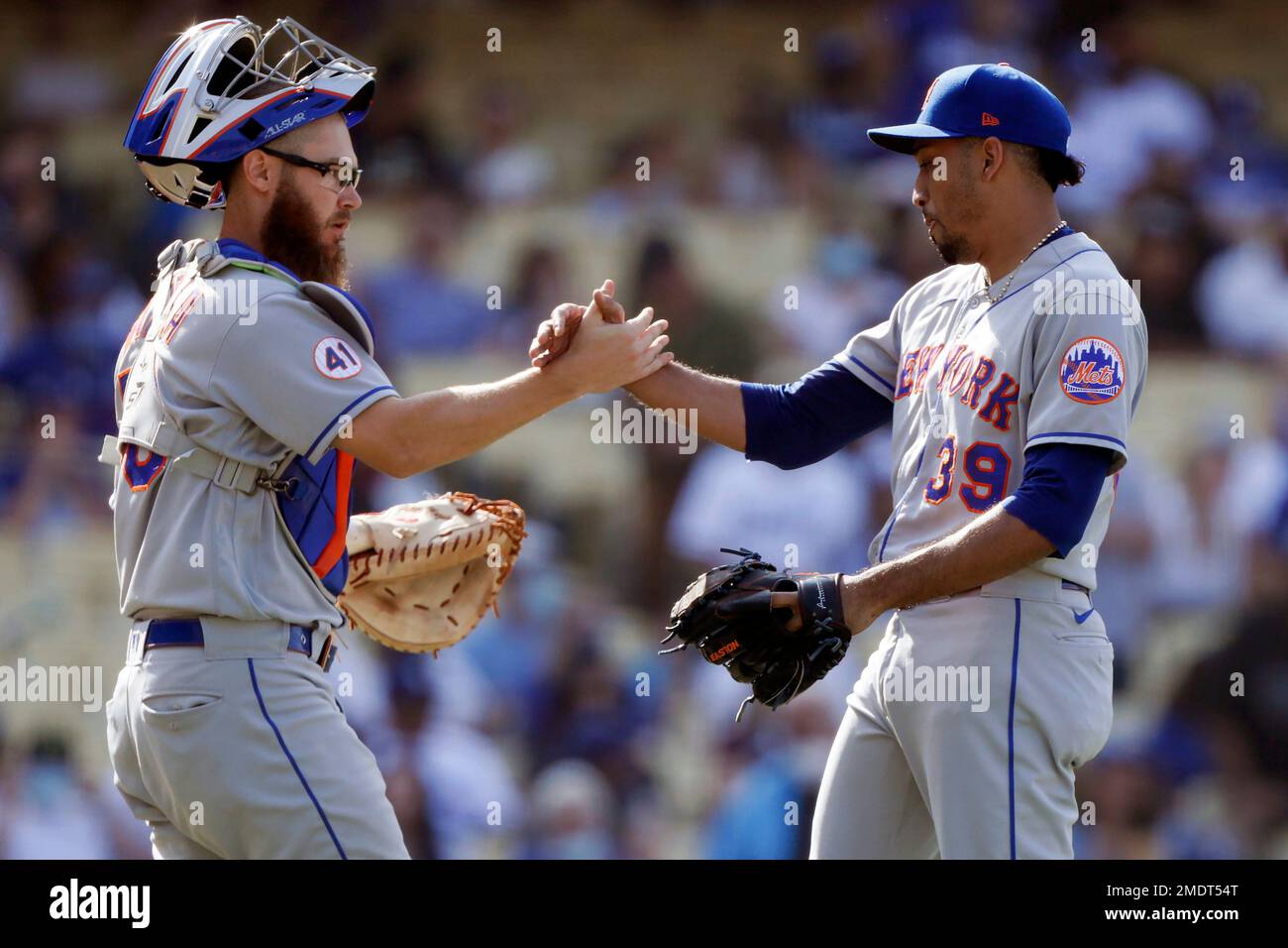 New York Mets catcher Patrick Mazeika, left, celebrates with relief ...