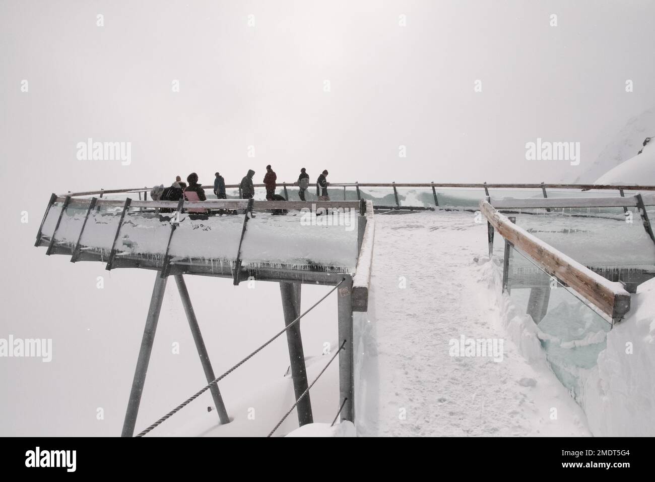 Snowboarding and skiing trip to Alps, Austria. Cold and windy day, lots ...