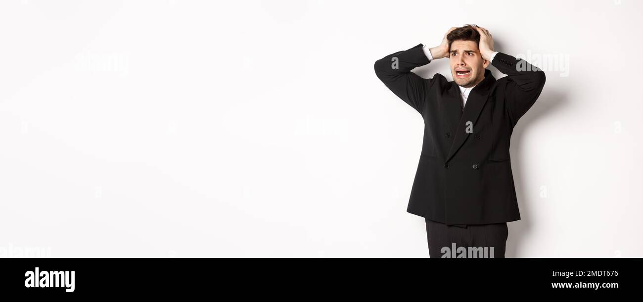 Image of anxious businessman start to panic, looking left with worried ...