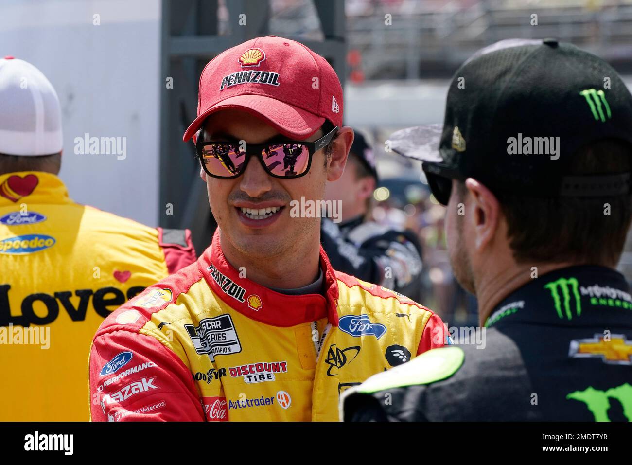 Joey Logano talks with other drivers before driver introductions at the ...