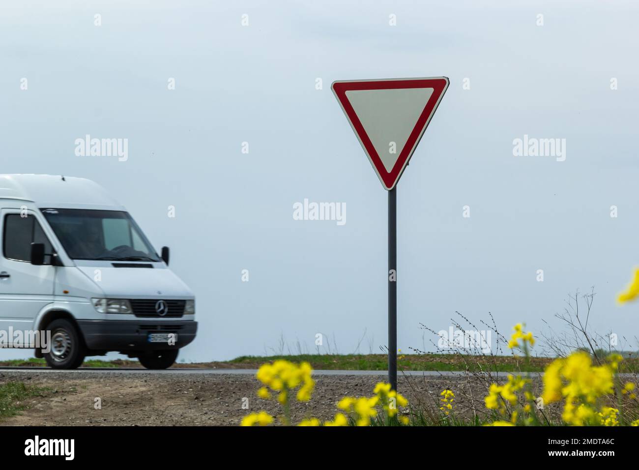 The sign Give way to the driver when exiting the highway at a rural ...