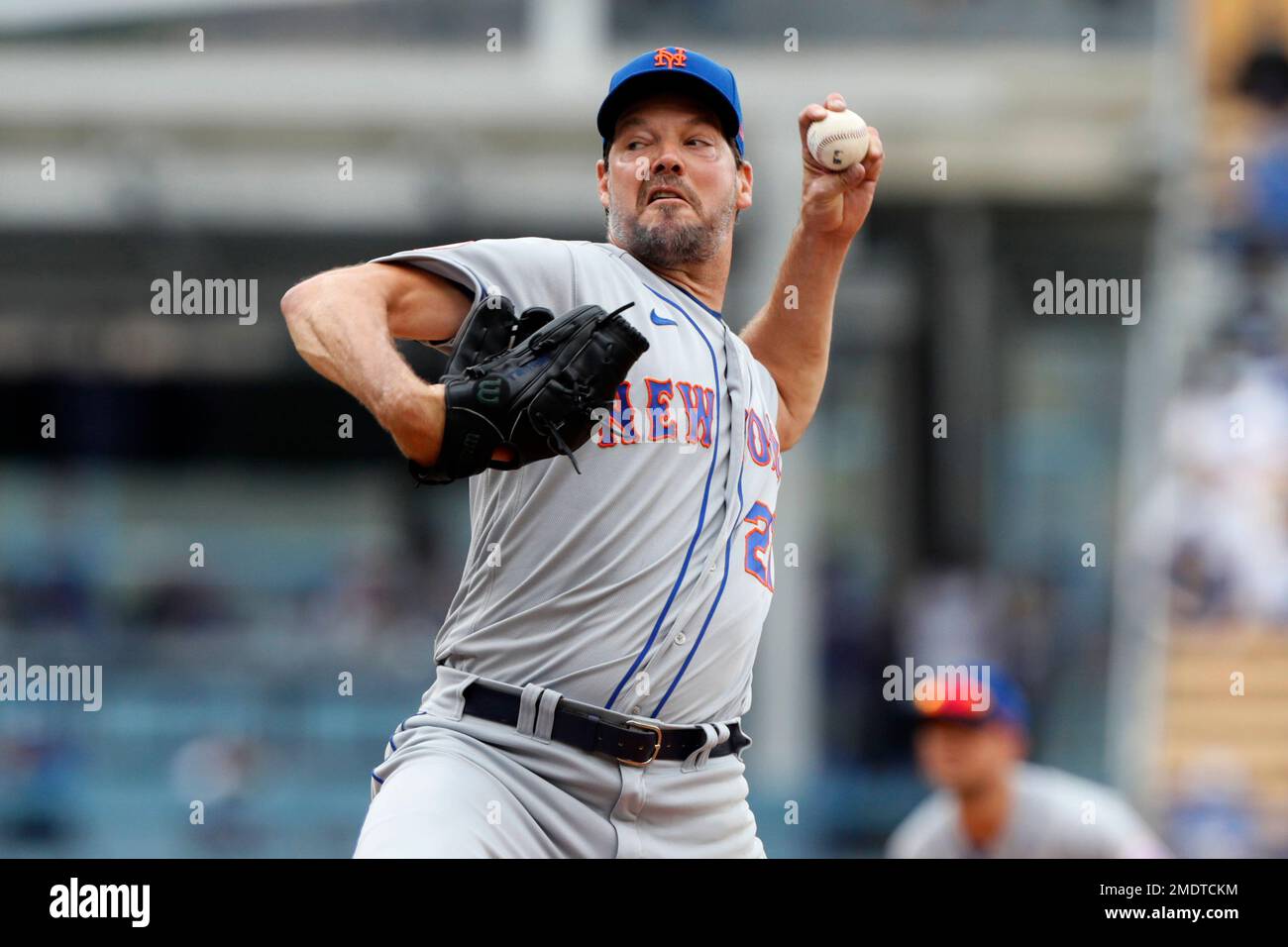 New York Mets starting pitcher Rich Hill throws to a Los Angeles ...