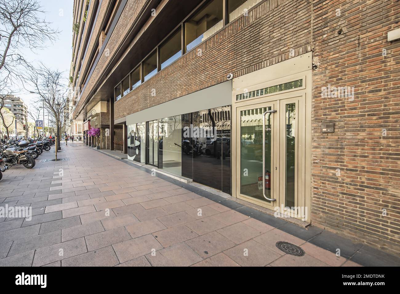 Commercial premises at the street door in a building with a dark brick ...