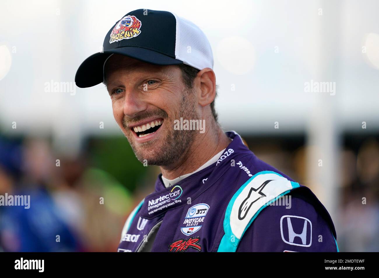 Romain Grosjean (51) smiles before the start an IndyCar auto race at ...