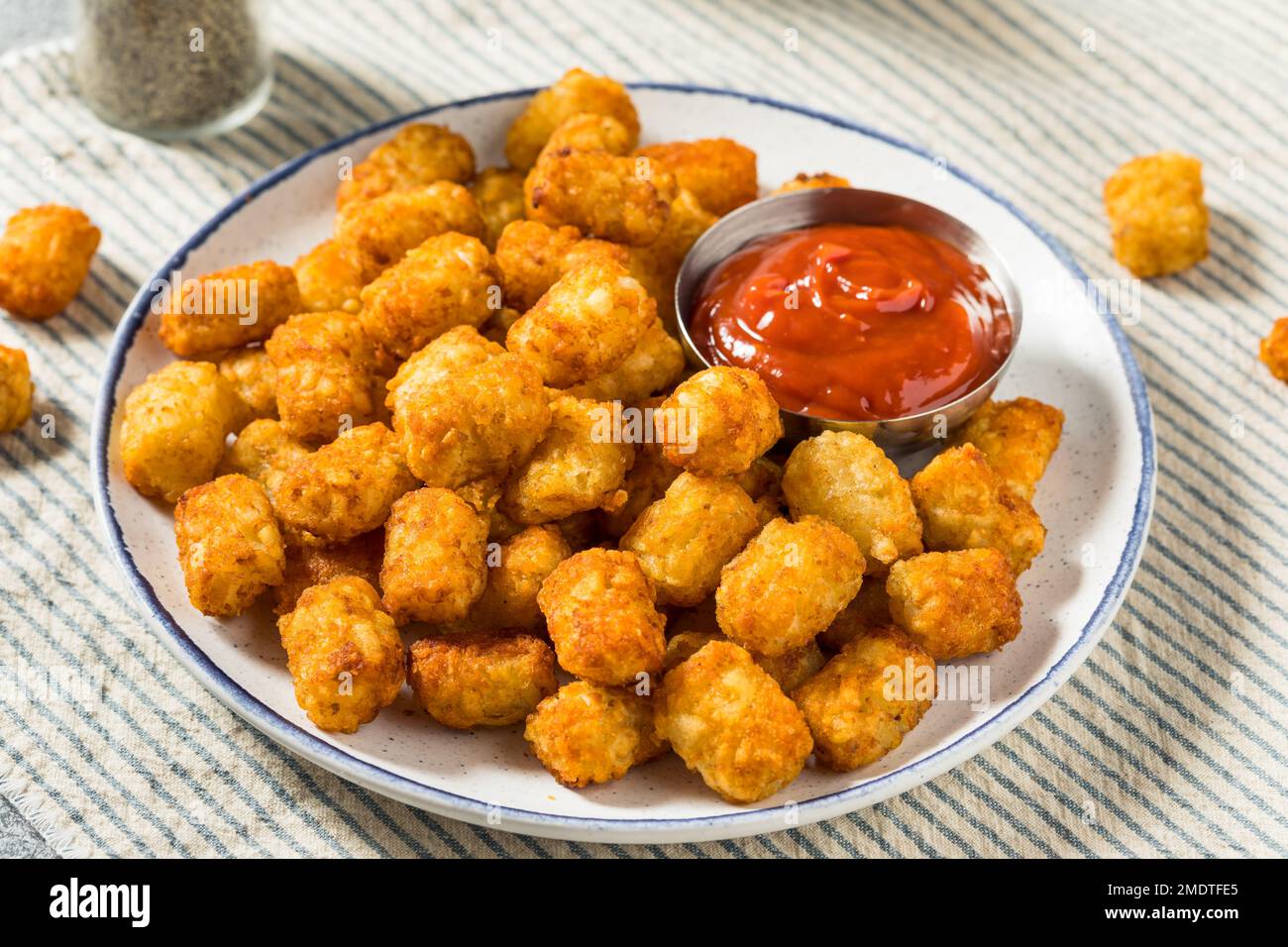 Homemade Baked Tater Tots Potatoes with Ketchup Stock Photo - Alamy