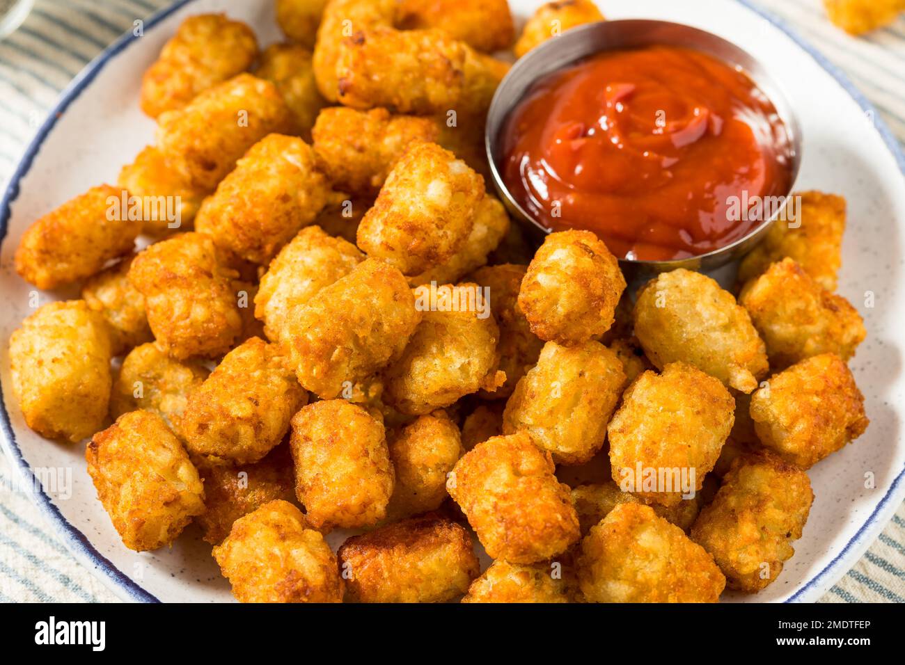 Homemade Baked Tater Tots Potatoes with Ketchup Stock Photo - Alamy