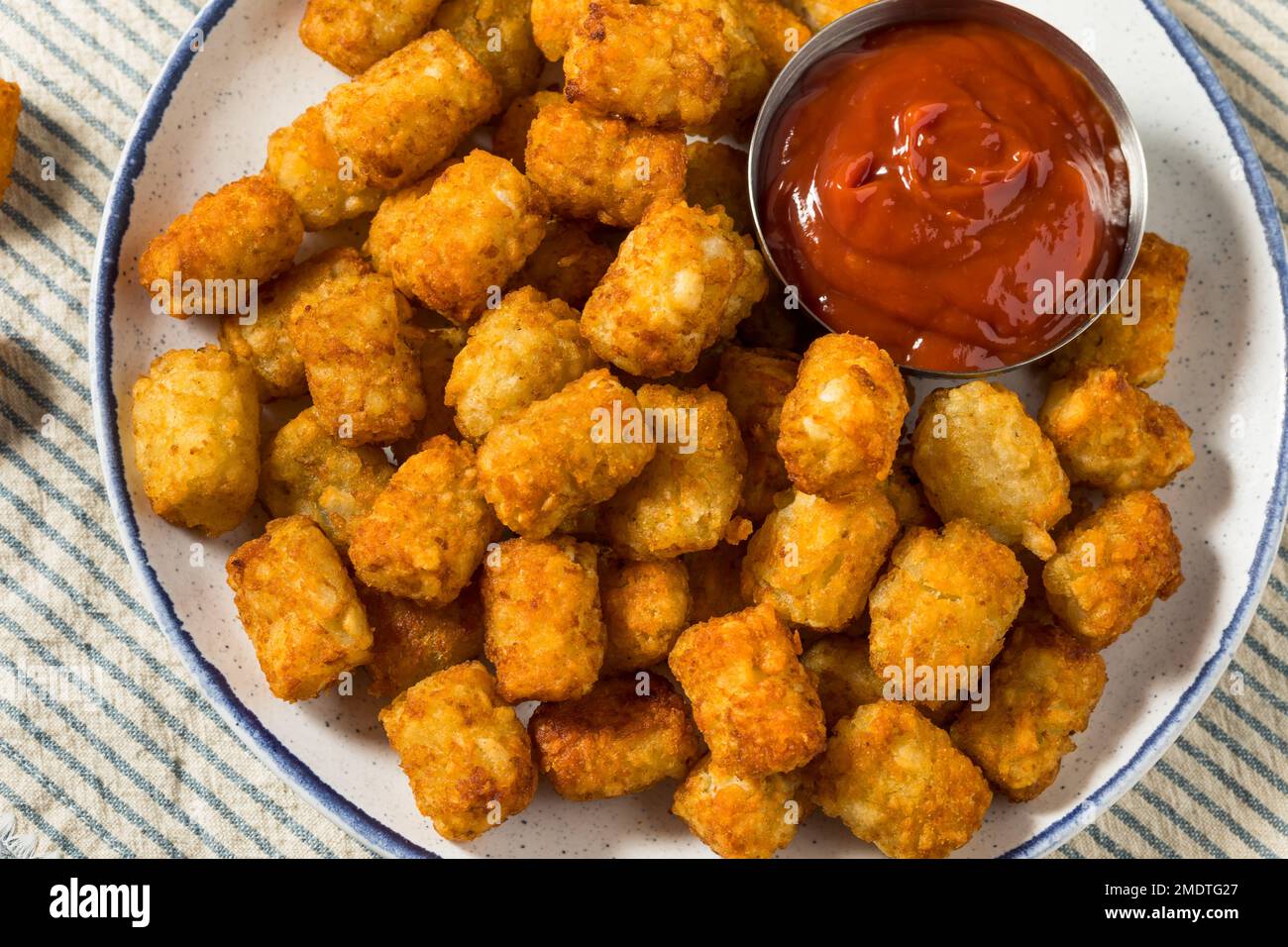 Homemade Baked Tater Tots Potatoes with Ketchup Stock Photo - Alamy