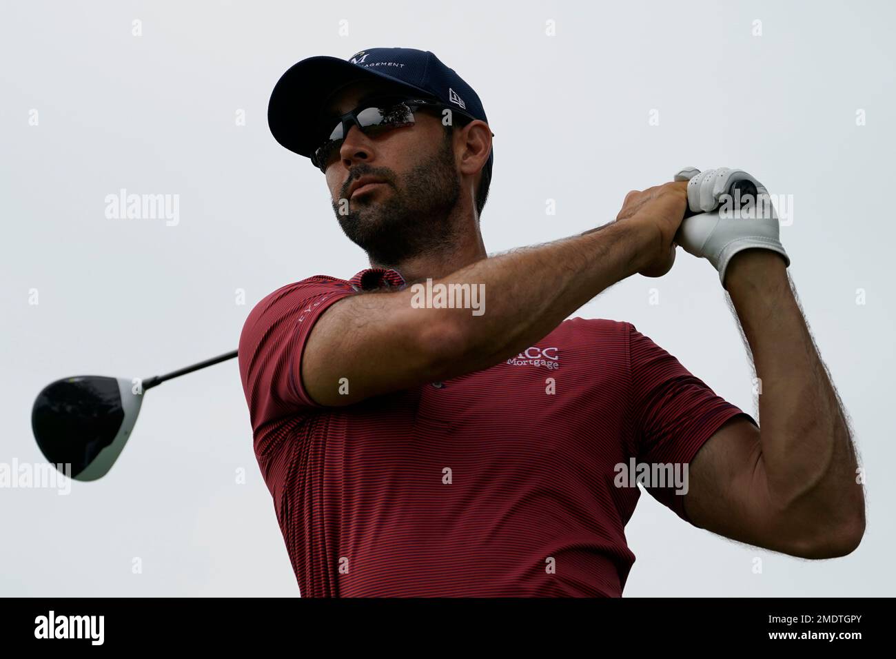 Cameron Tringale watches his shot from the sixth tee in the third round ...