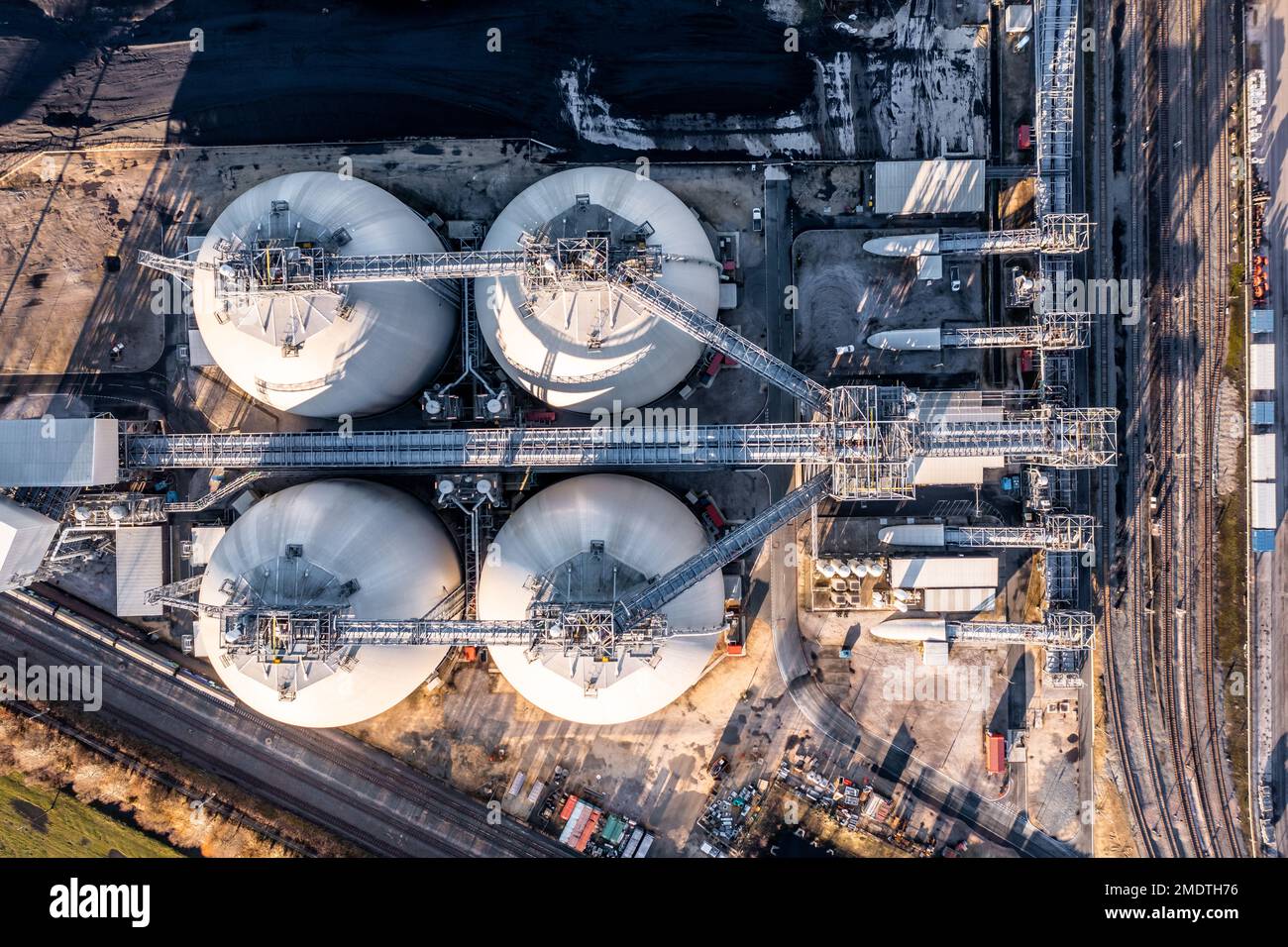 Aerial view directly above the large biofuel storage tanks holding huge ... Aerial view directly above the large biofuel storage tanks holding huge ...
