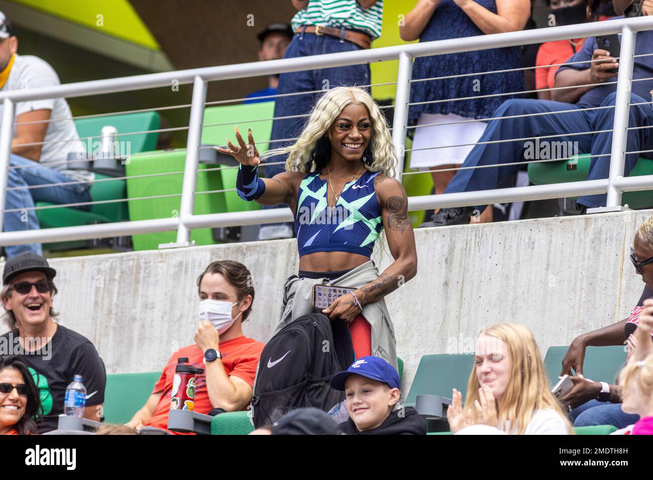 American sprinter Sha'carri Richardson waves at a fellow teammate from ...