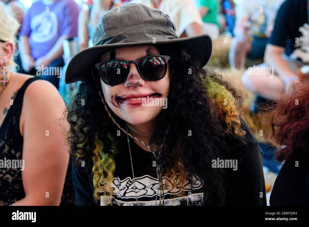 A fan poses for a photo at the 2021 Gathering of the Juggalos on ...
