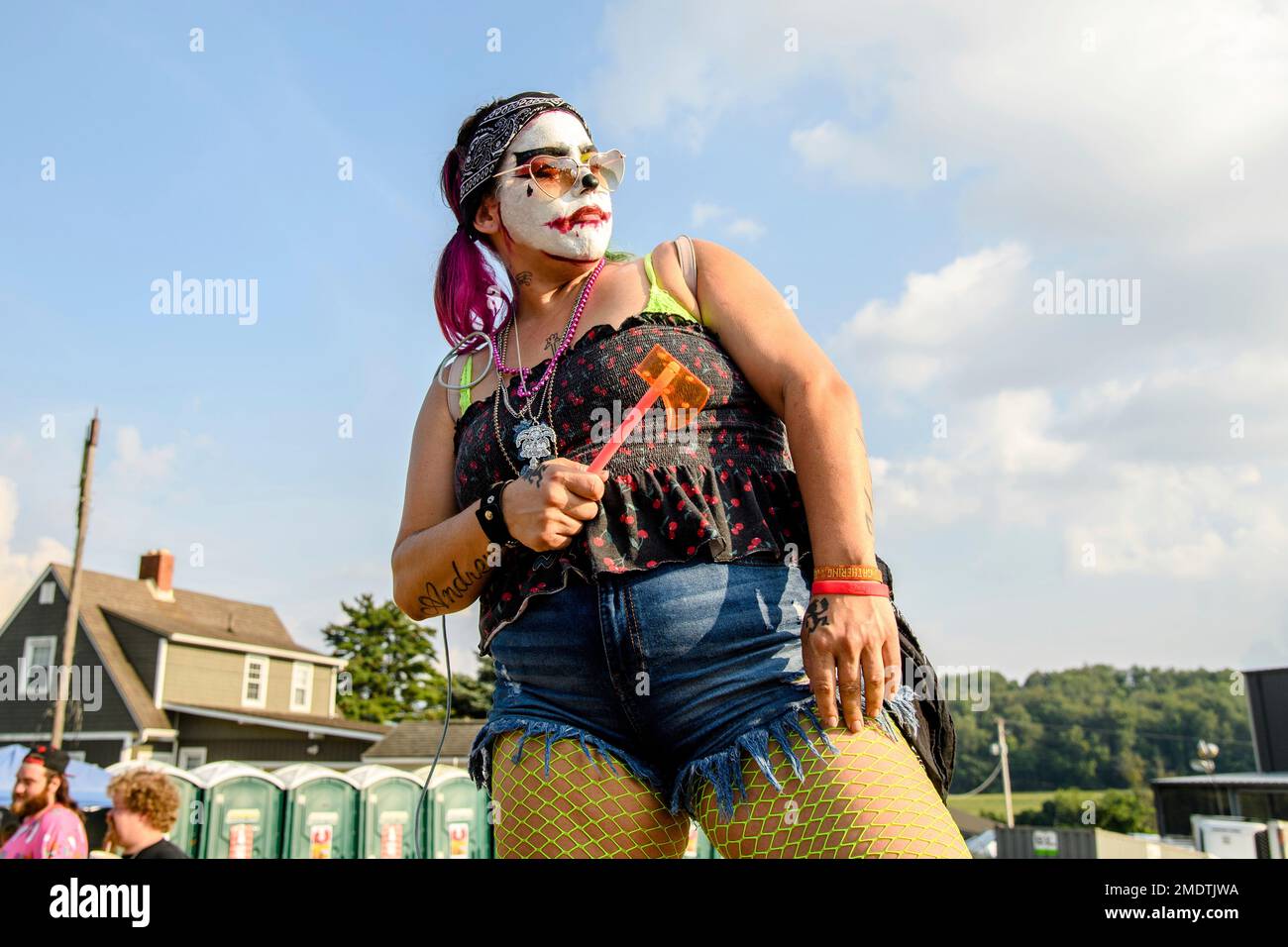 A fan poses for a photo at the 2021 Gathering of the Juggalos on ...