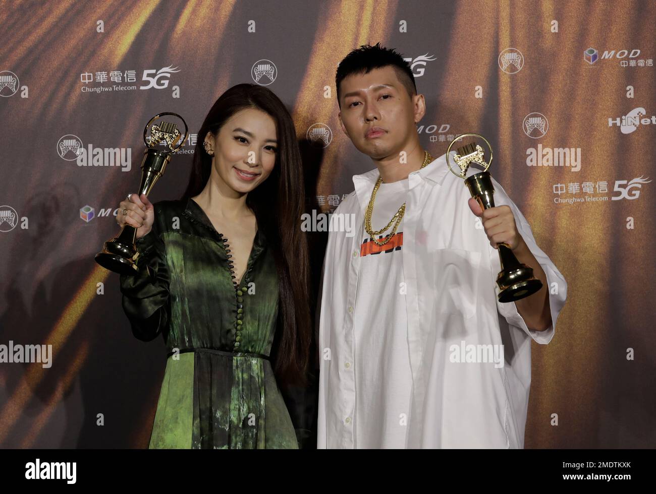 Taiwanese singer Hebe Tien, left and Soft Lipa hold their awards of ...