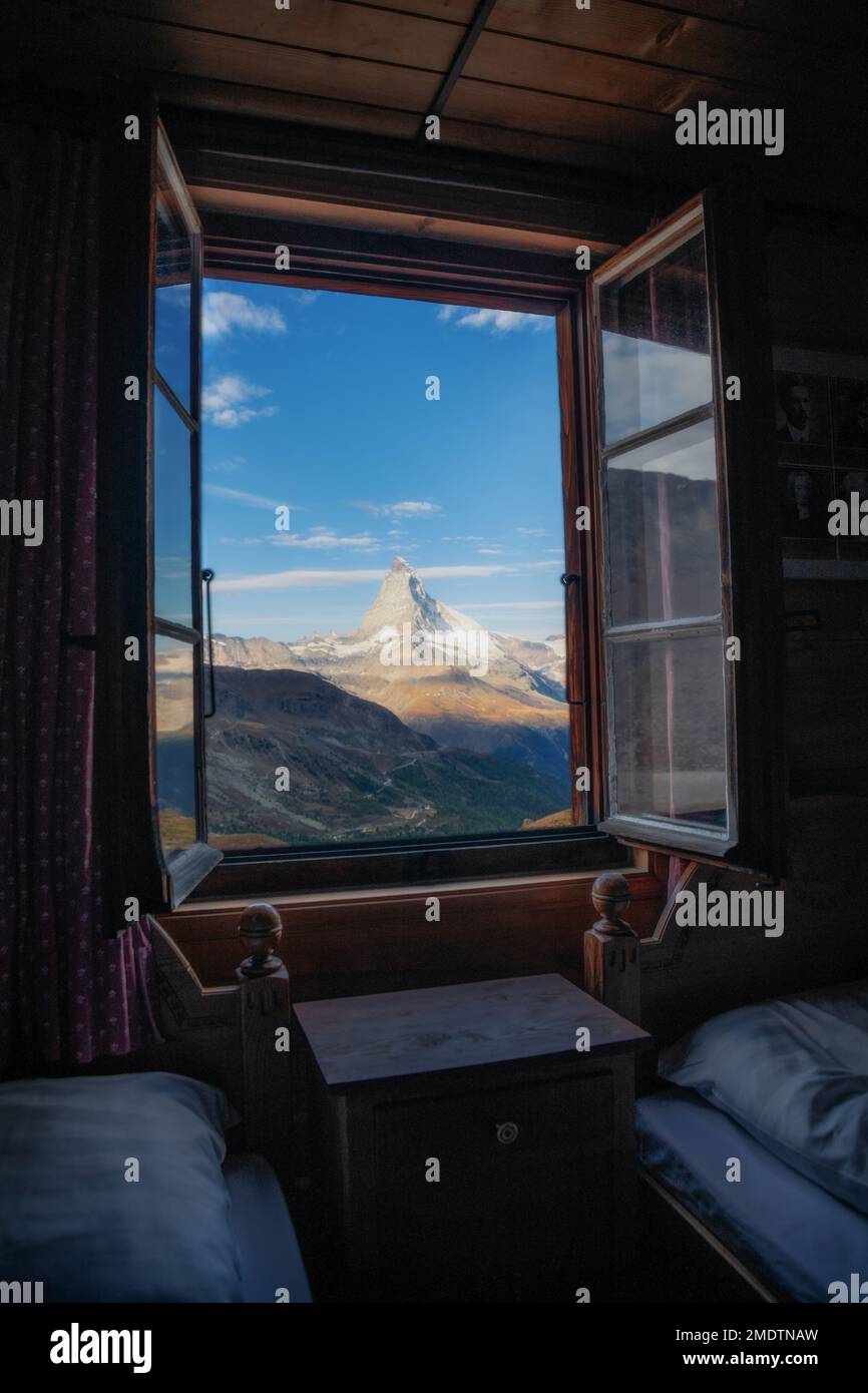 A mountain landscape photographed from a house, the window forms the ...