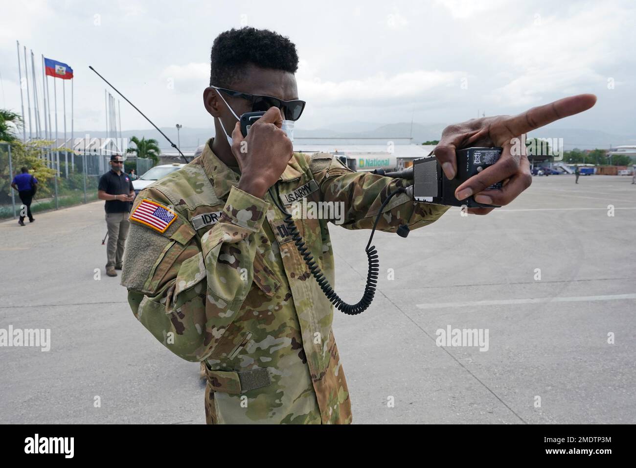 U.S. Army Capt. Alix Idrache directs helicopter traffic arriving at ...
