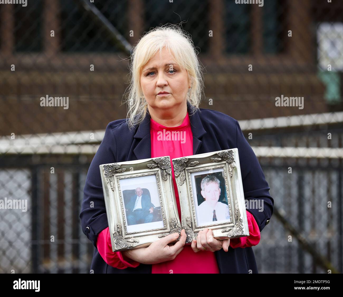 Angela McKearney holding an image of her uncle John (Jack) McKearney ...
