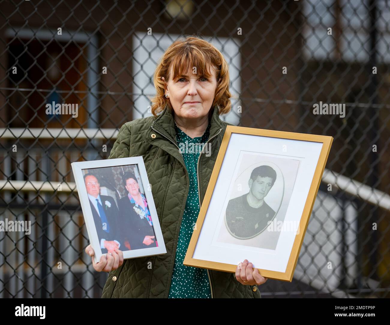 Bernadette McKearney, widow of Kevin McKearney, holding an image of her ...