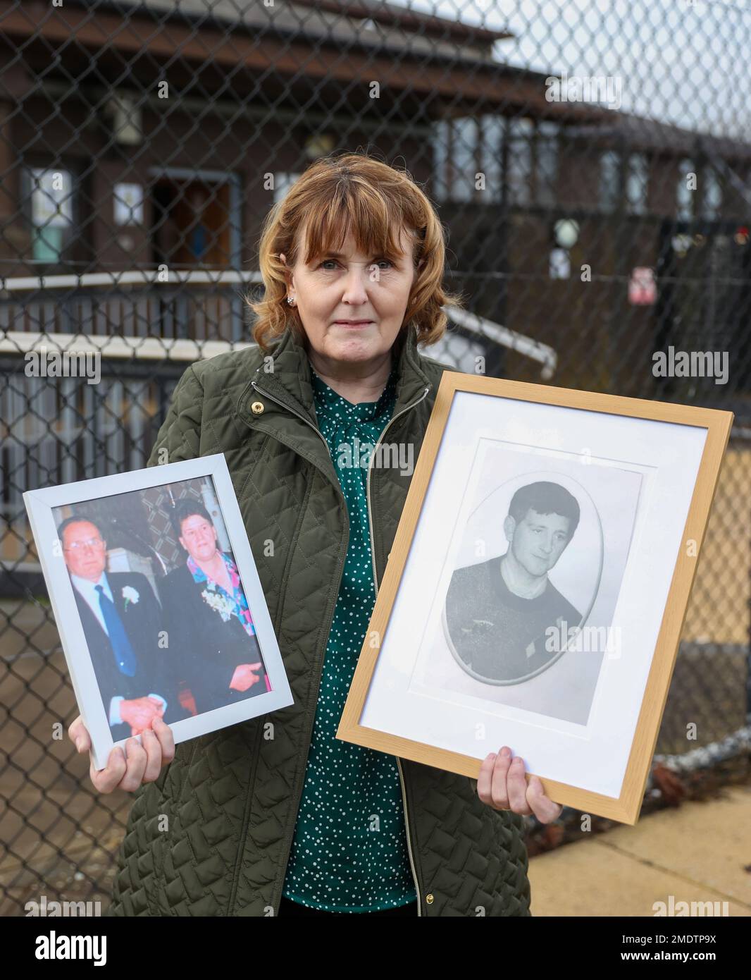 Bernadette McKearney, widow of Kevin McKearney, holding an image of her ...
