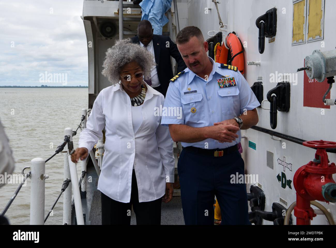 U.S. Coast Guard Cmdr. Andrew Pate, right, Commanding Officer of the ...