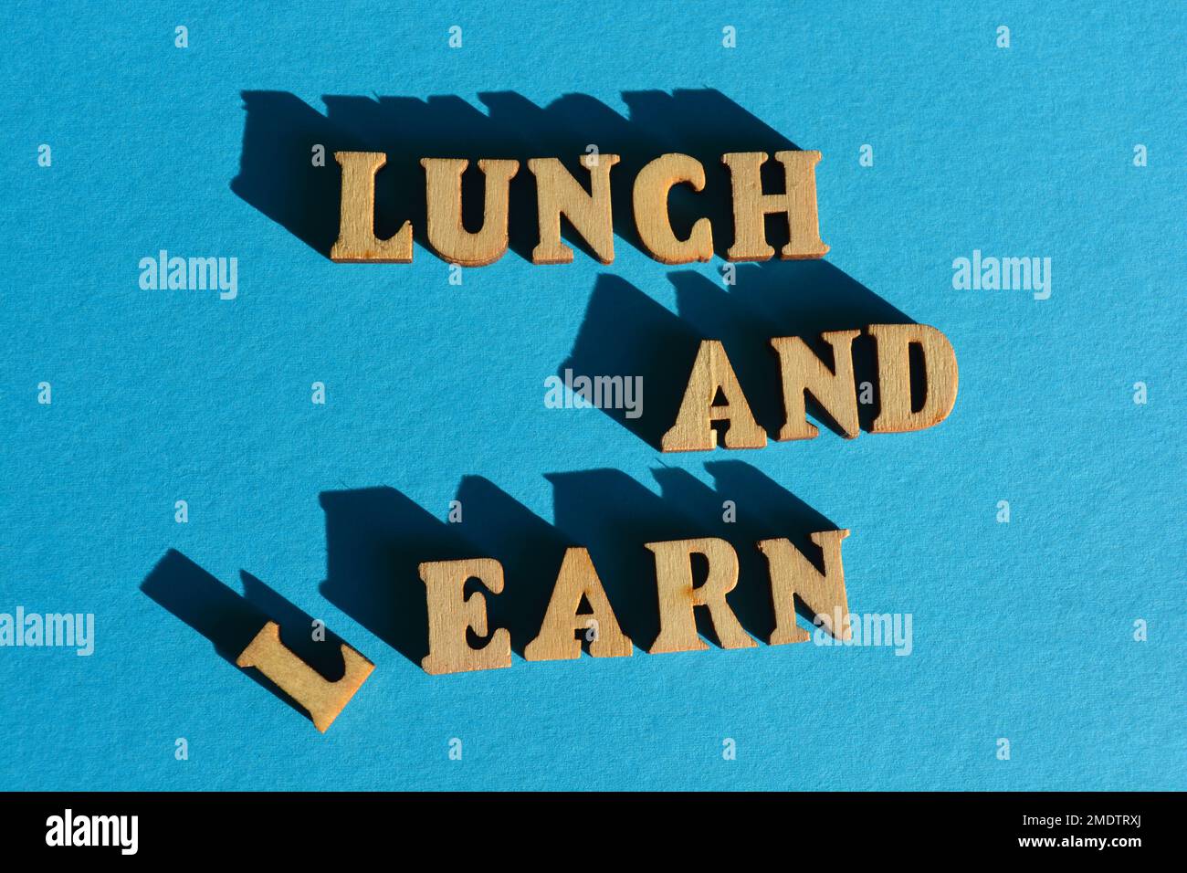 Lunch and Learn, Earn, words in wooden alphabet letters isolated on ...