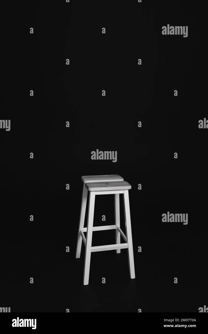 minimalist wooden chair against black background. Concept modern ...