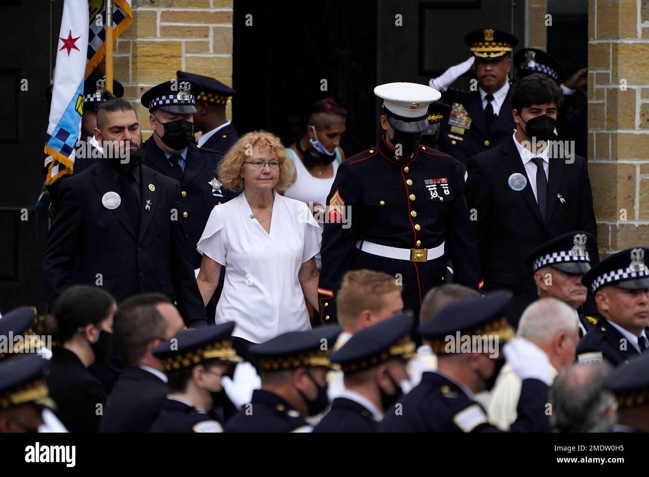 Elizabeth French, center, and her son Andrew, left, follow the casket ...