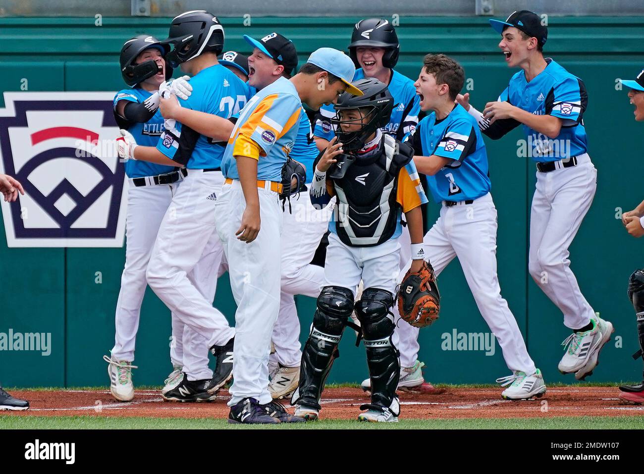 Manchester Connecticut's Arlen Peyman, second from left, is greeted ...