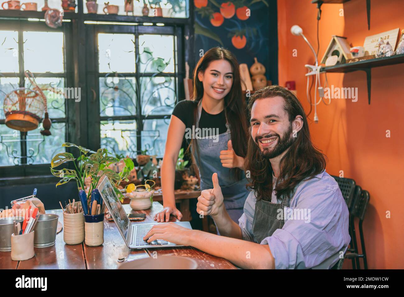 happy artist pottery workshop owner couple friend together enjoy small ...