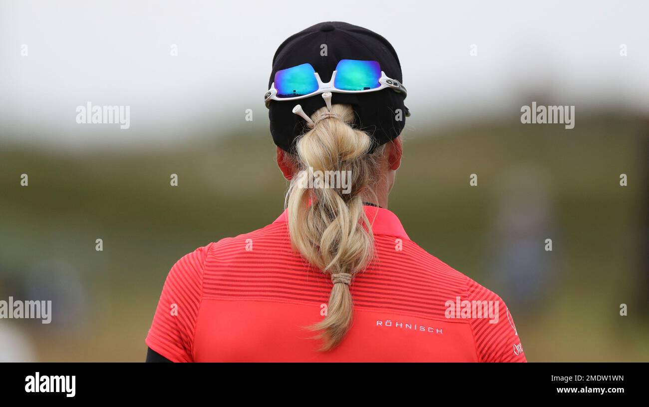 Germany's SophiaPopov wears two tees in her hair as she walks from the ...