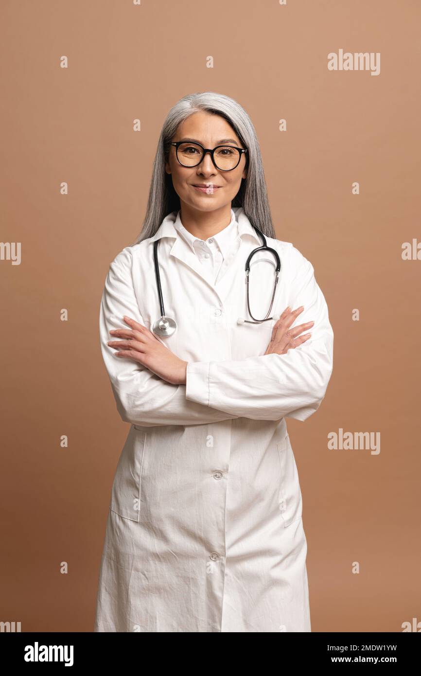 Vertical photo of intelligent professional gray-haired Asian female ...