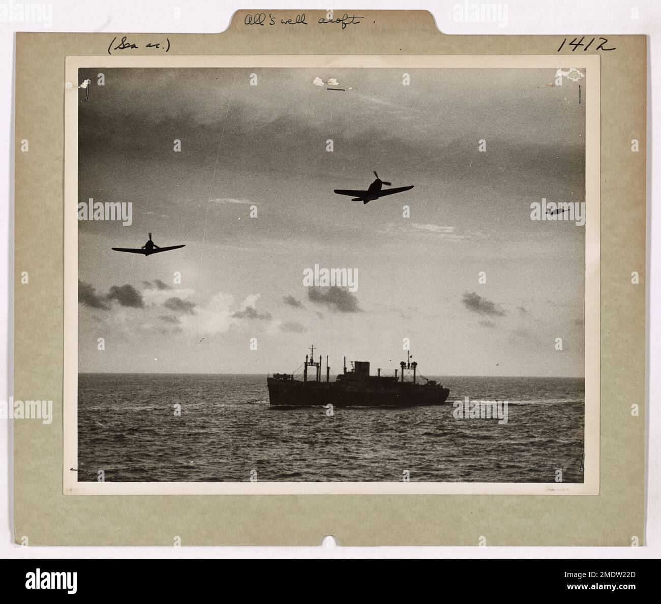 A Coast Guard assault transport operates with Allied fighter planes ...