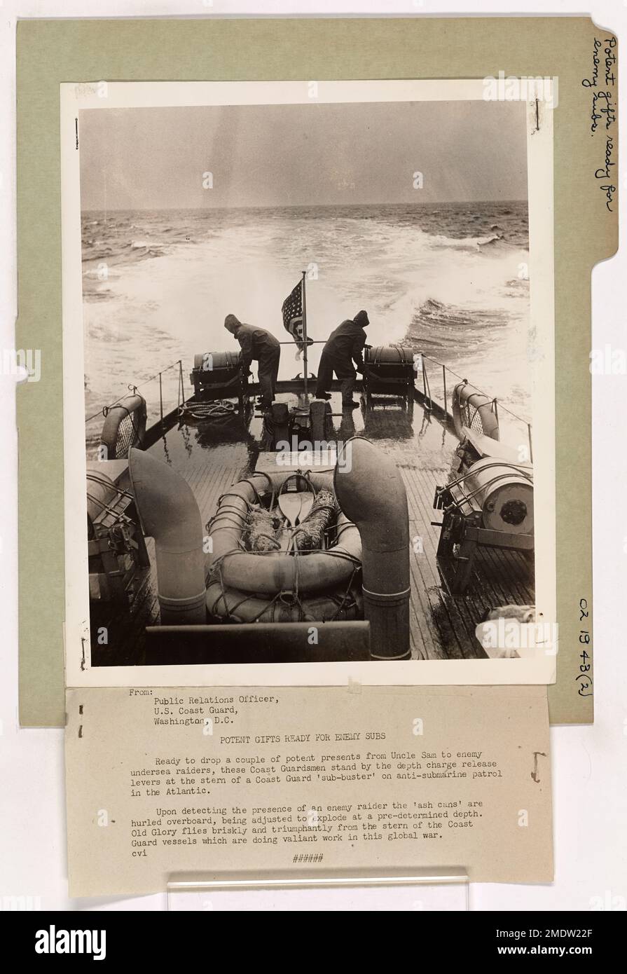 A Coast Guardsman stands by the depth charge release levers at the ...