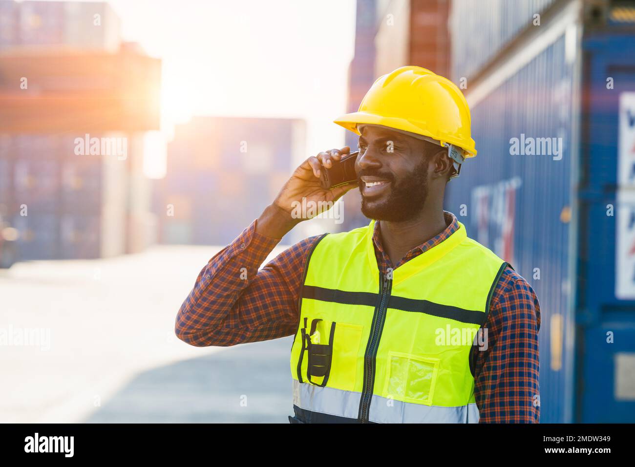 industry male worker using cellphone calling contact people with happy ...