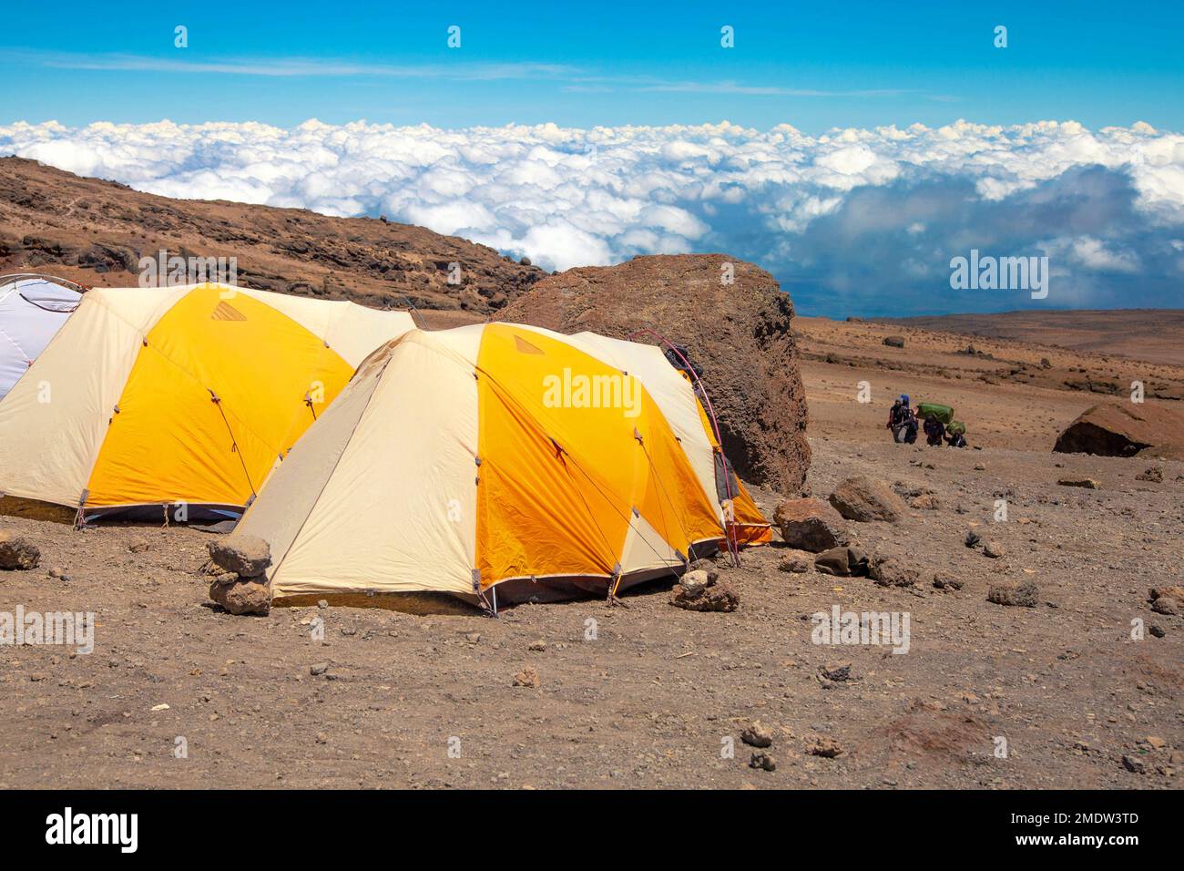 Yellow tents in the base camp above the clouds Stock Photo - Alamy