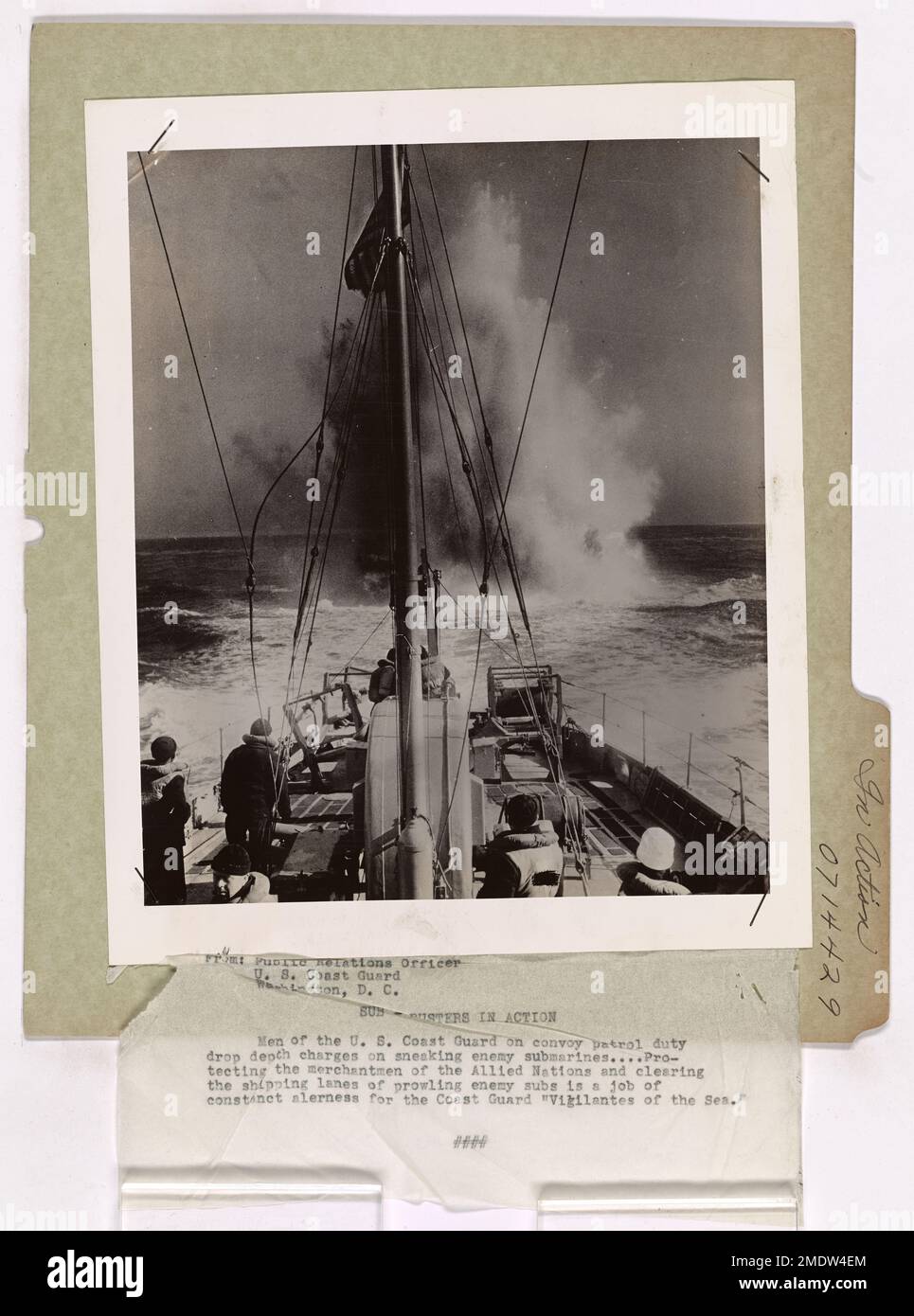 A depth charge explodes from a Coast Guard ship, demonstrating its role ...