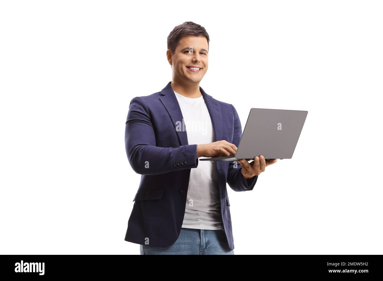 Man holding an open laptop computer and smiling at camera isolated on ...