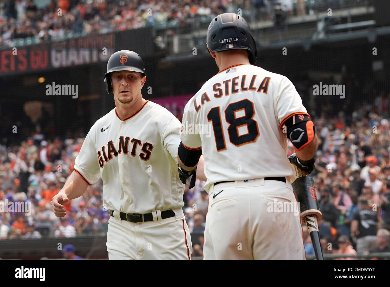 San Francisco Giants' Alex Dickerson, left, is congratulated by Tommy ...