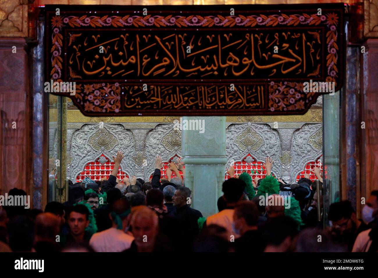 Shiite Muslim worshippers pray inside the holy shrine of Imam Hussein ...
