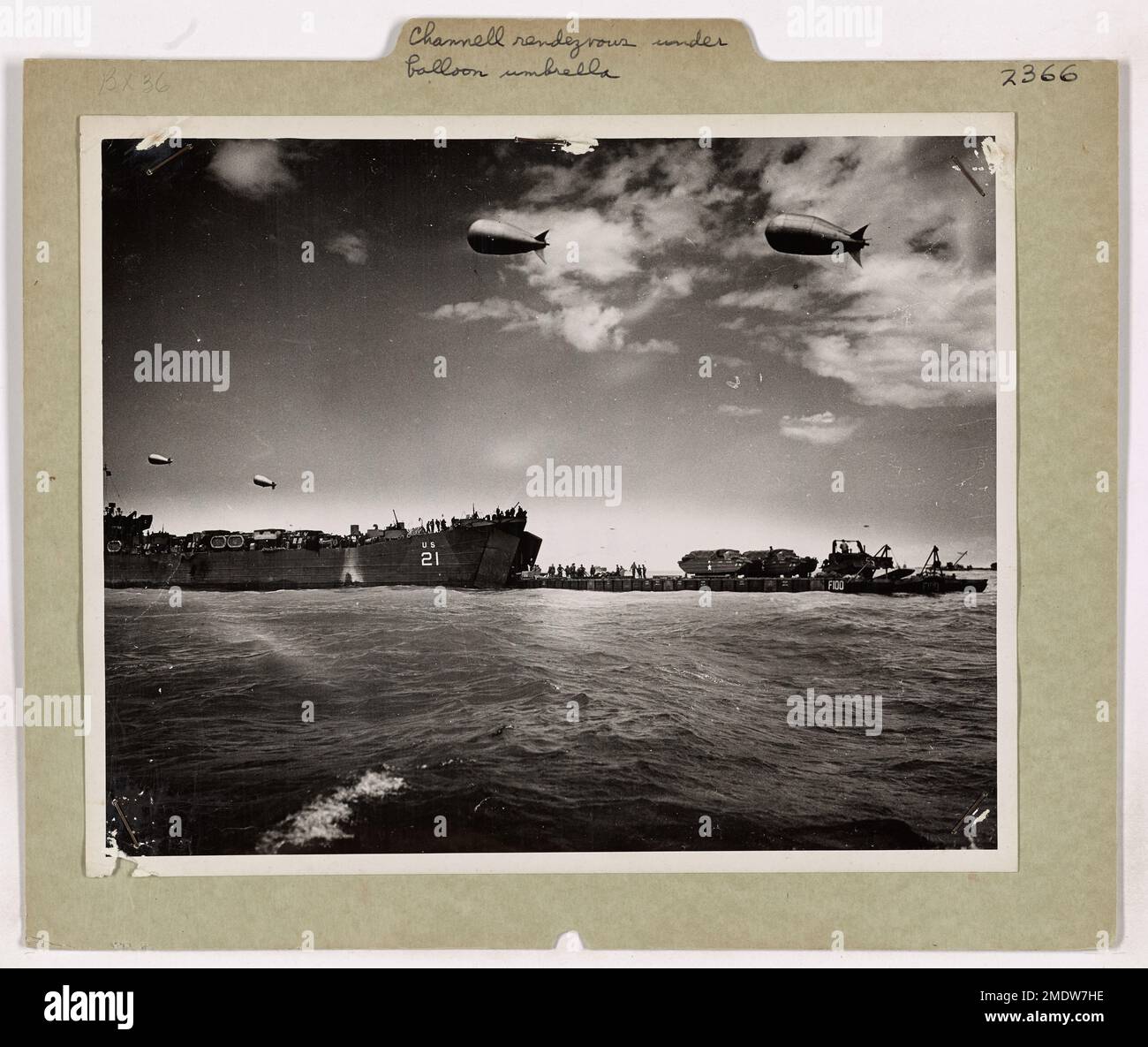 A Coast Guard tank landing ship (LST) uses barrage balloons for ...
